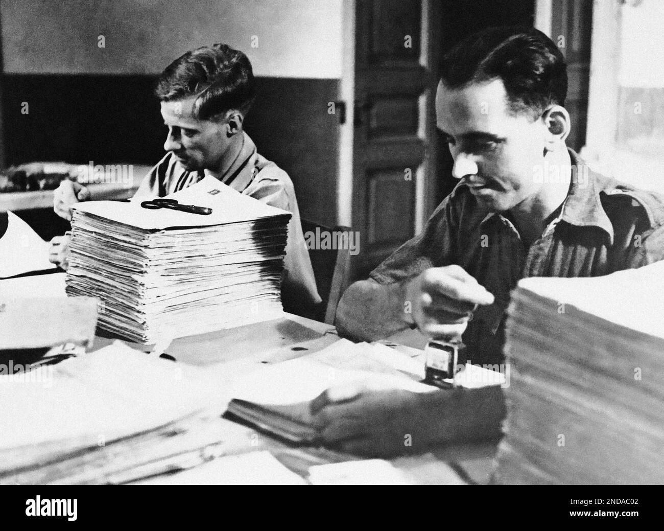 The airgraph letters for outgoing mail bags are being stamped at the ...