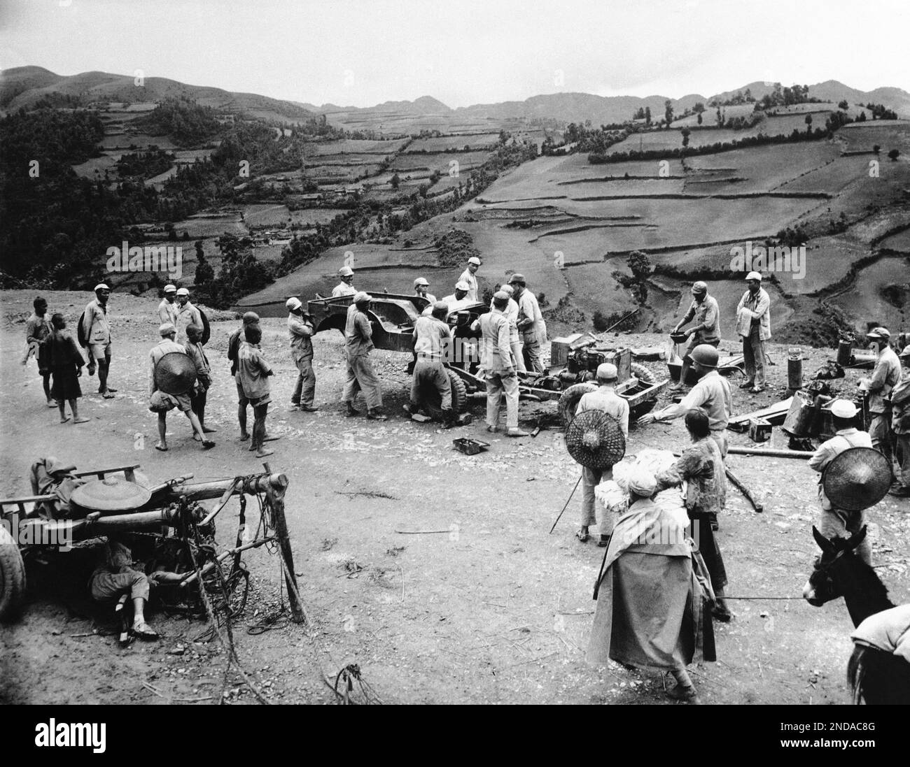 Chinese mechanics reassemble an American lend-lease jeep on the Burma ...