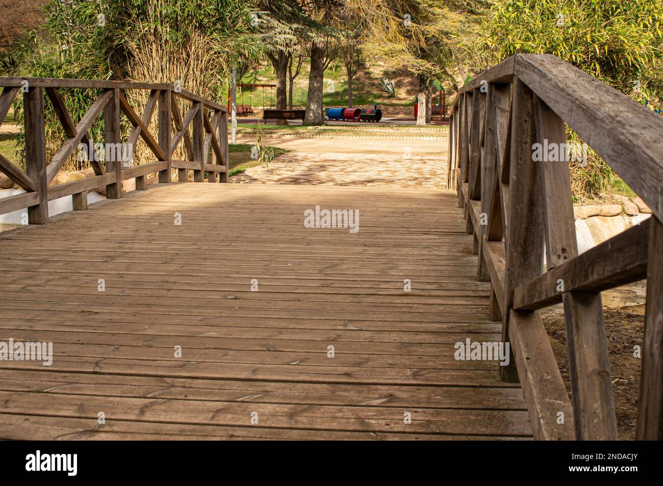 Construction of wooden bridge and protection railing in artificial lake ...