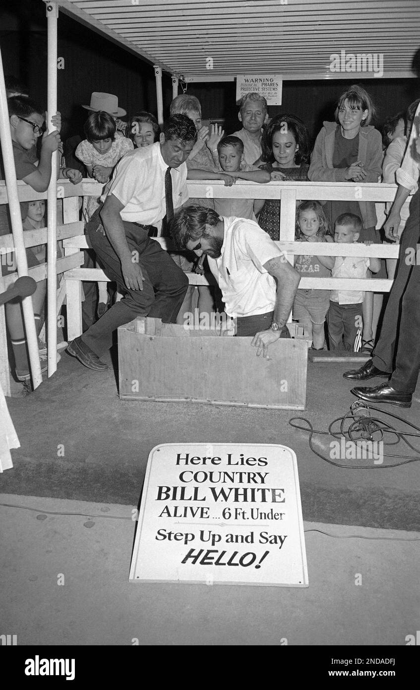 Country Bill White, sporting a heavy black beard, emerges from his ...