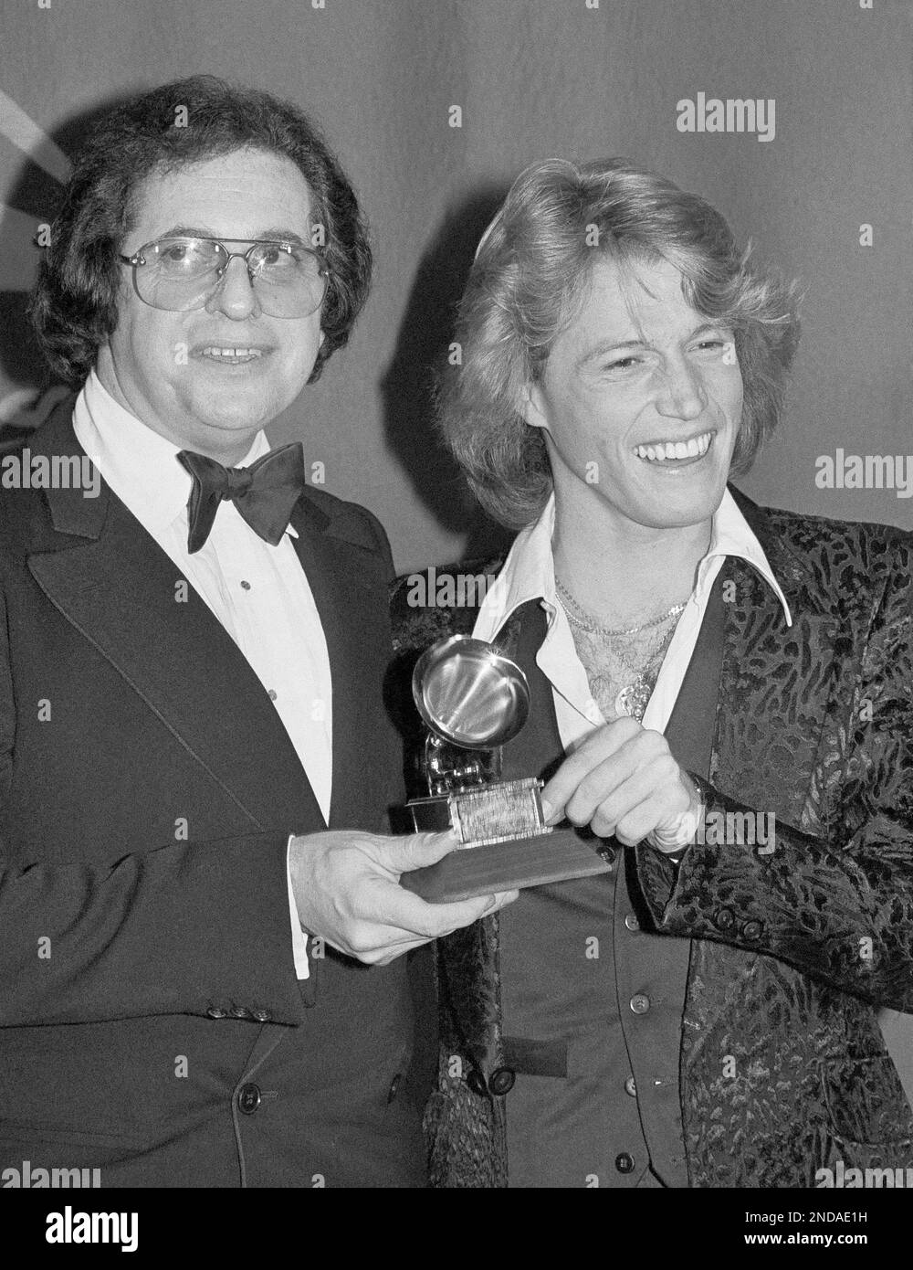 Record producer Phil Ramone and singer Andy Gibb smile at the Grammy ...