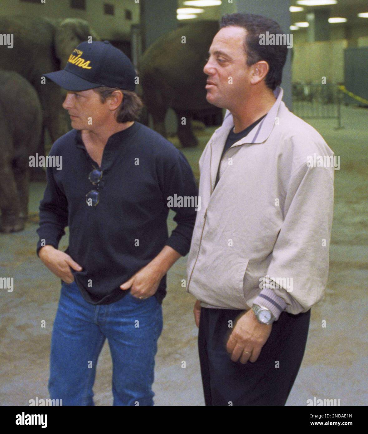 Actor Michael J. Fox, left, and singer-songwriter Billy Joel, right ...