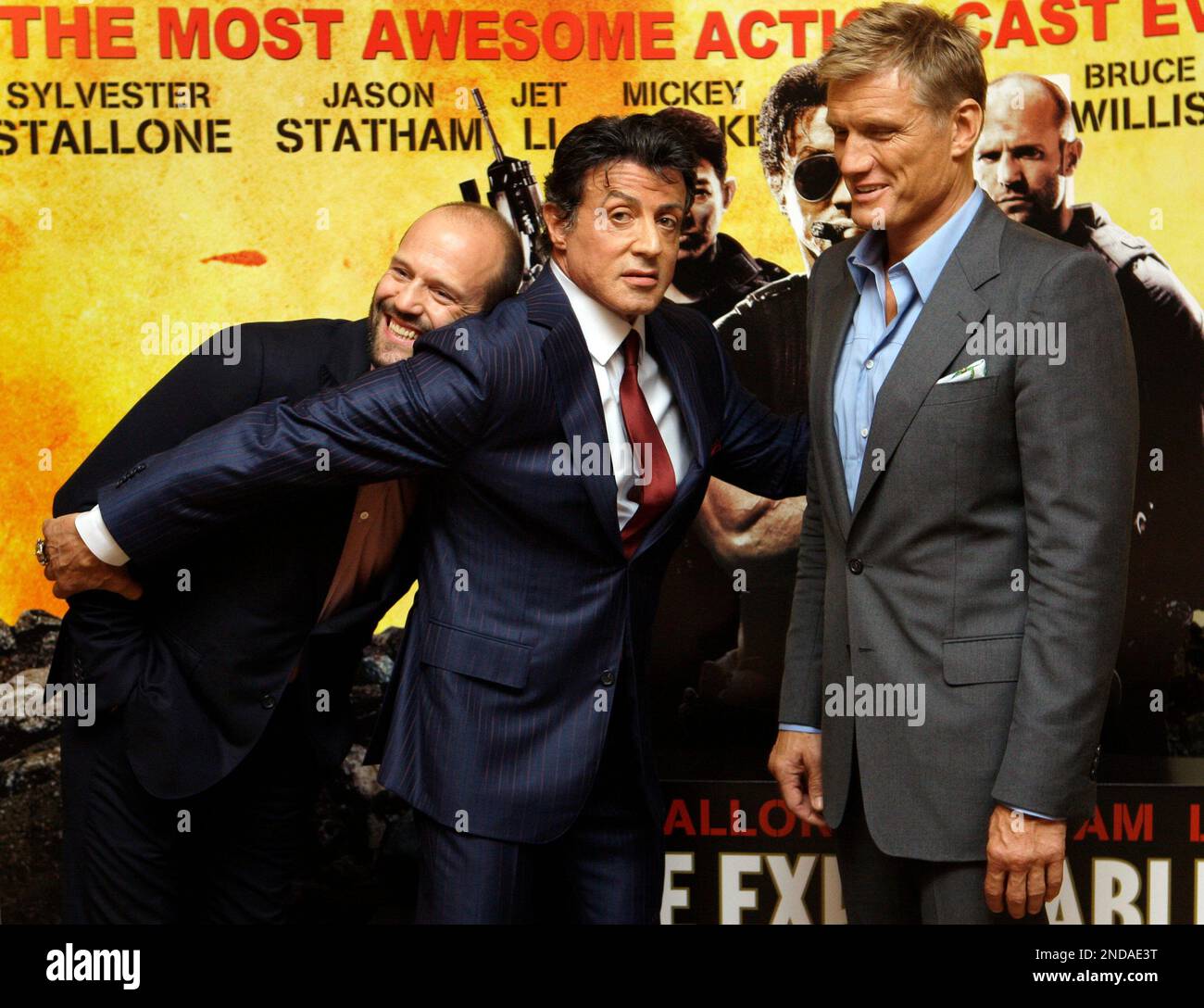 U.S actor Sylvester Stallone, centre, puts his arms around British ...