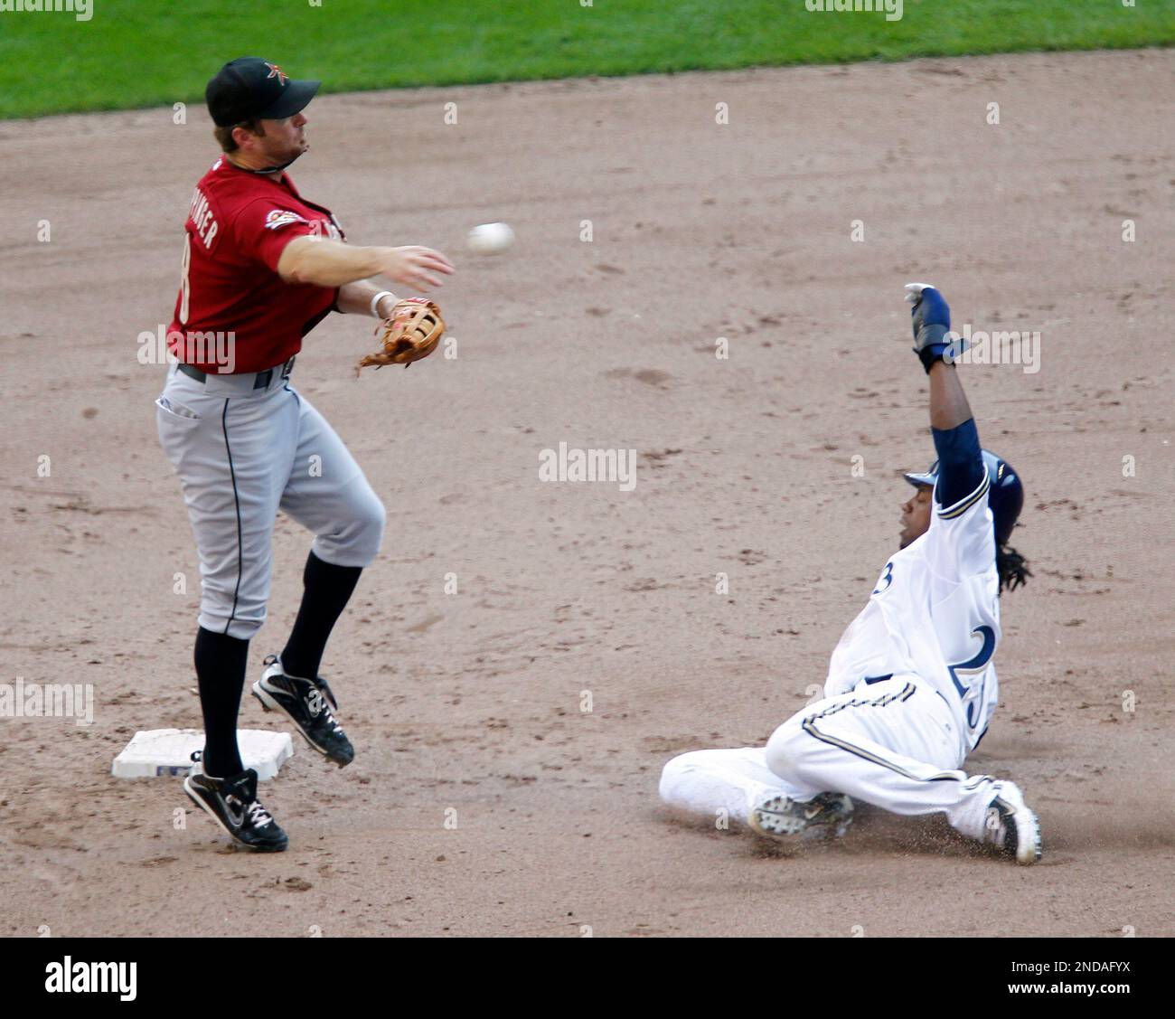 Houston Astros' Jeff Keppinger, left, forces out Milwaukee Brewers ...