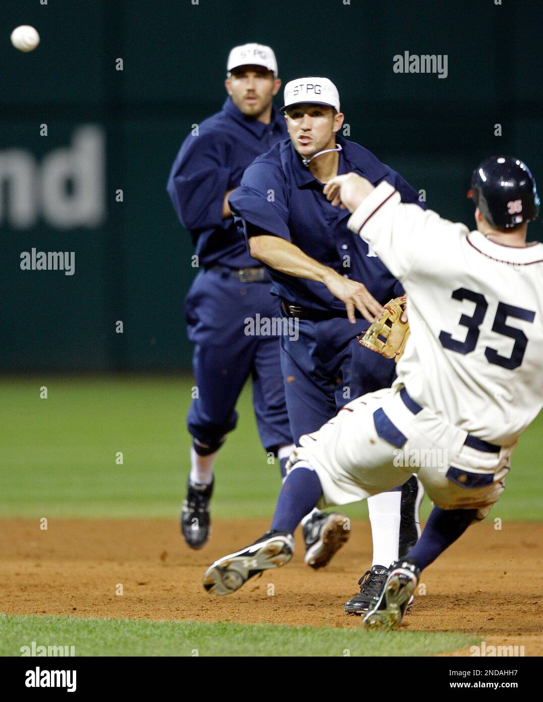 Minnesota Twins' Trevor Plouffe, center, turns a double play against ...