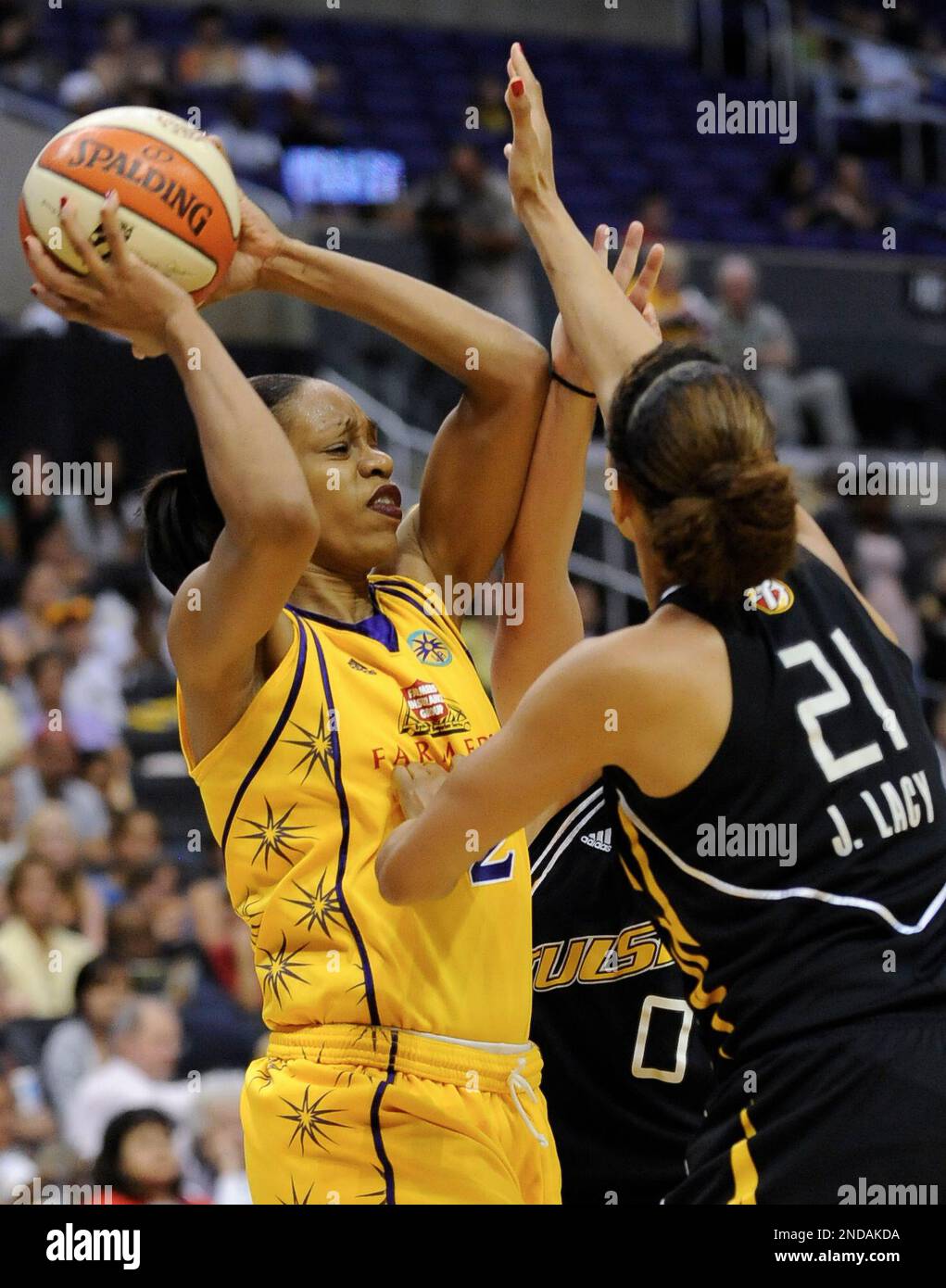 Los Angeles Sparks forward Tina Thompson, left, is double teamed by ...