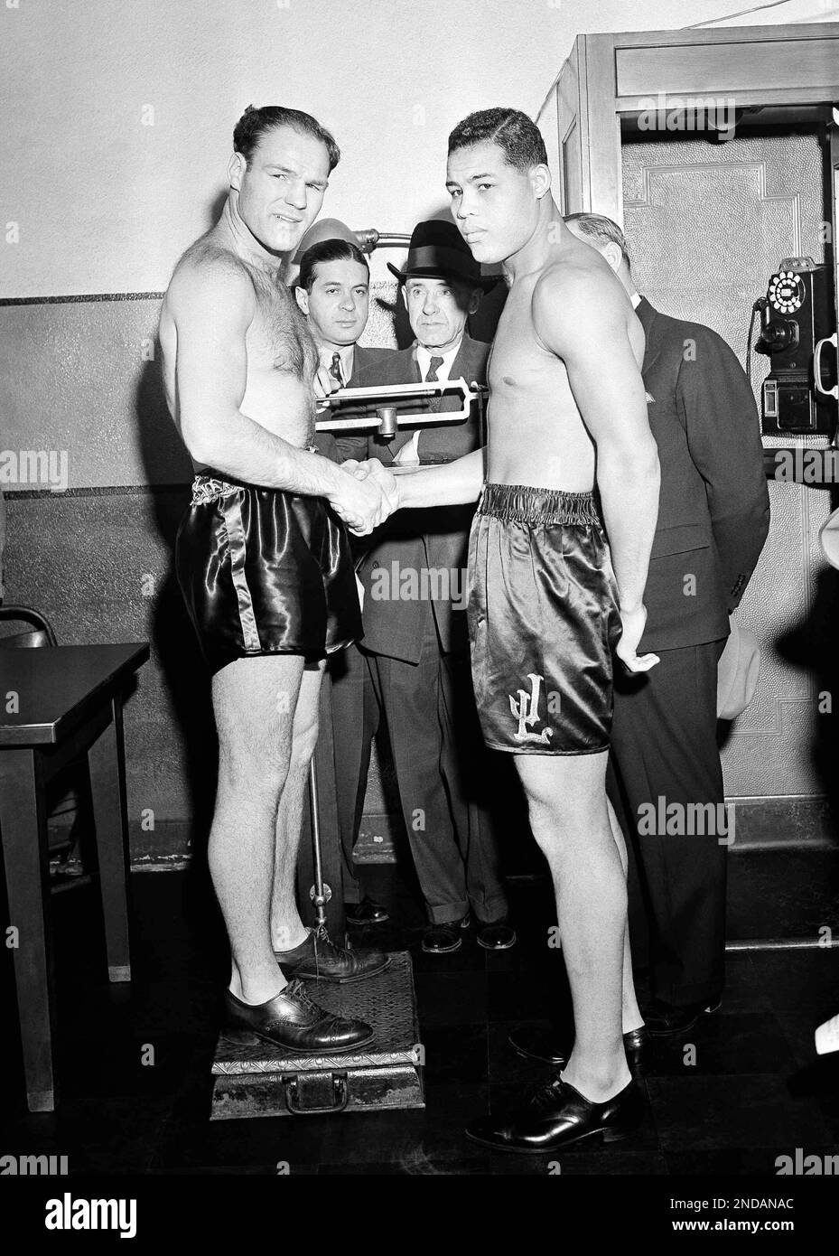 James Clarence “Red” Burman, left, tipped the scales at 188 pounds when ...
