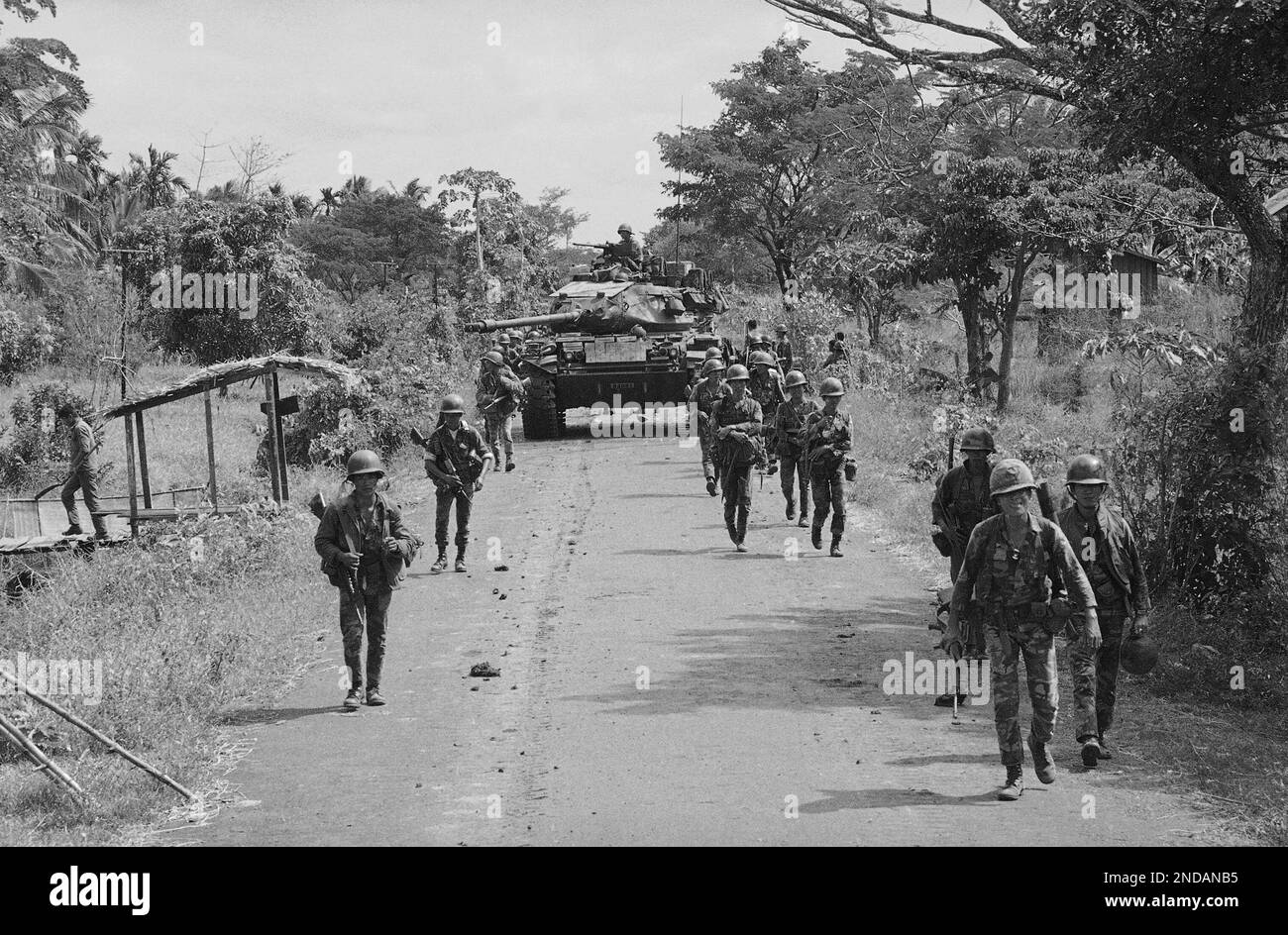 South Vietnamese troops backed by tanks move down section of Route 7 ...