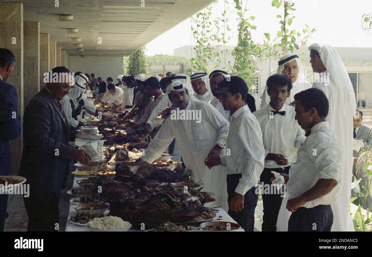 Lunch is served and eaten at a typical Mansef banquet on the terrace of ...