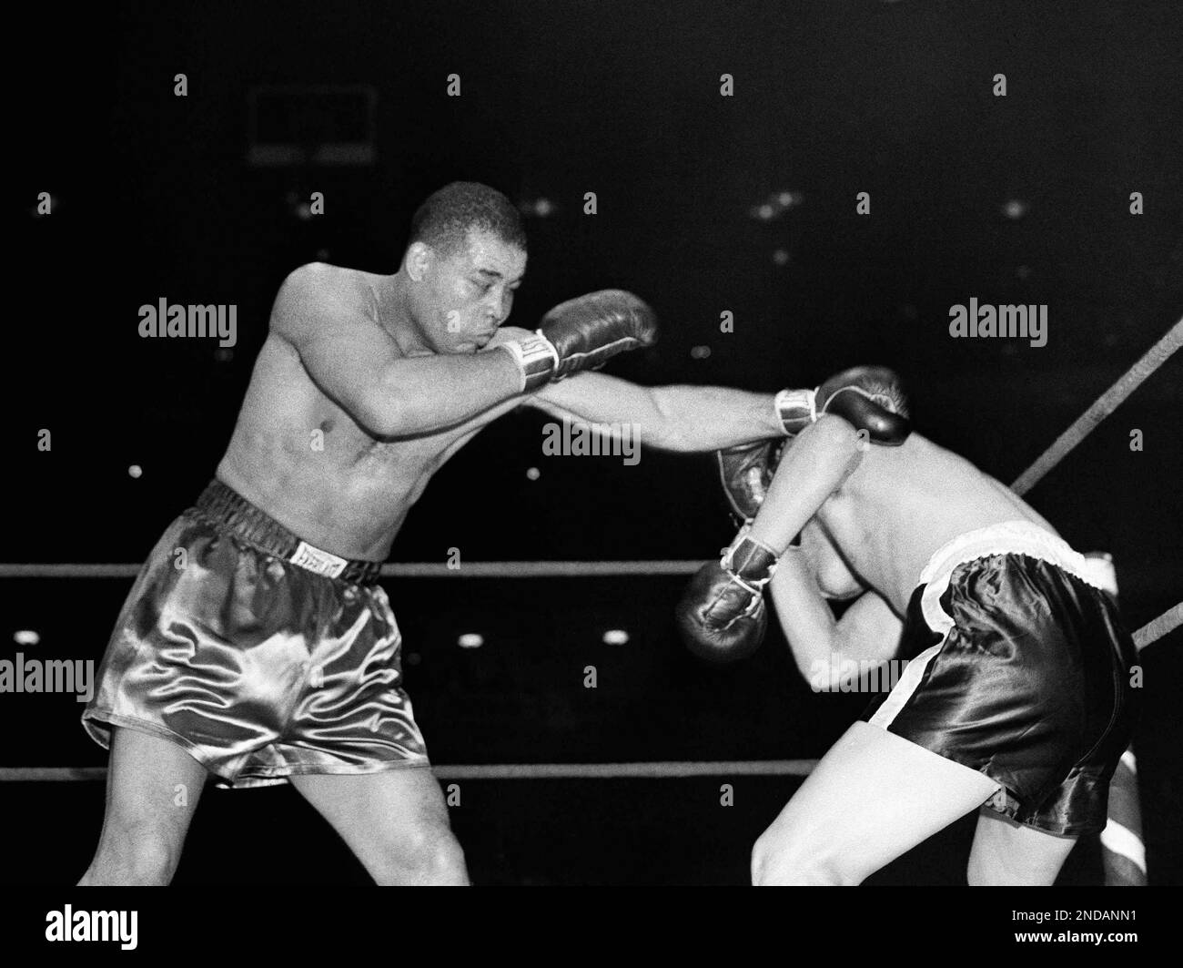 Joe Louis, left, former world's heavyweight champion, misses with a ...