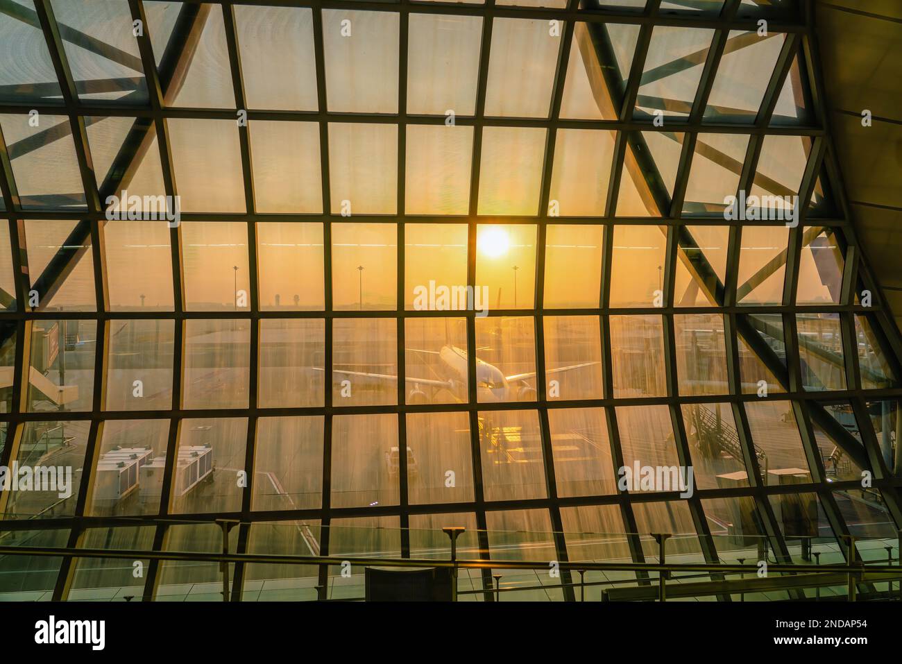 Scenic Sunrise over airplane standing still on the Suvarnabhumi Airport ...