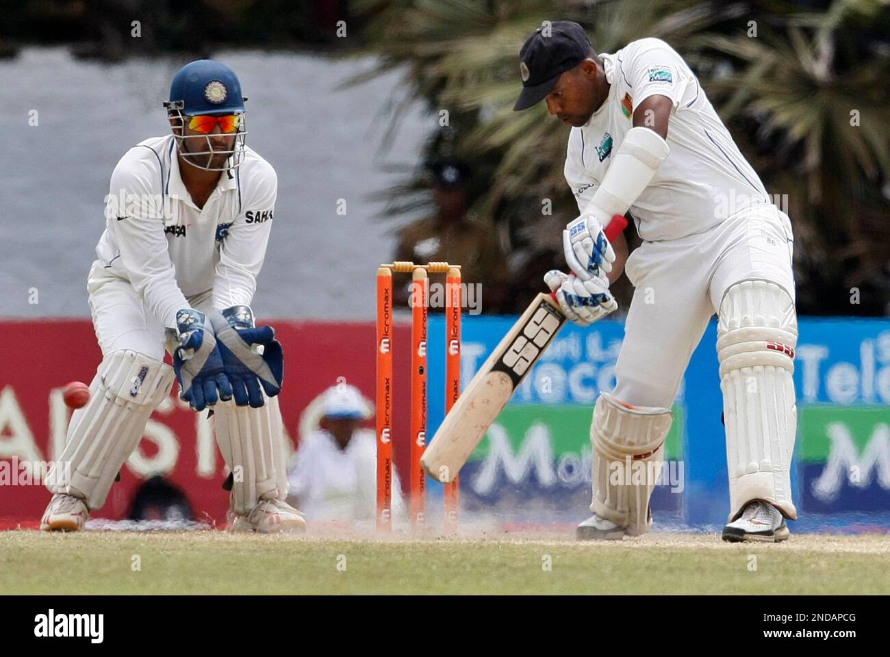 Sri Lankan batsman Thilan Samaraweera plays a shot as India's Mahendra ...