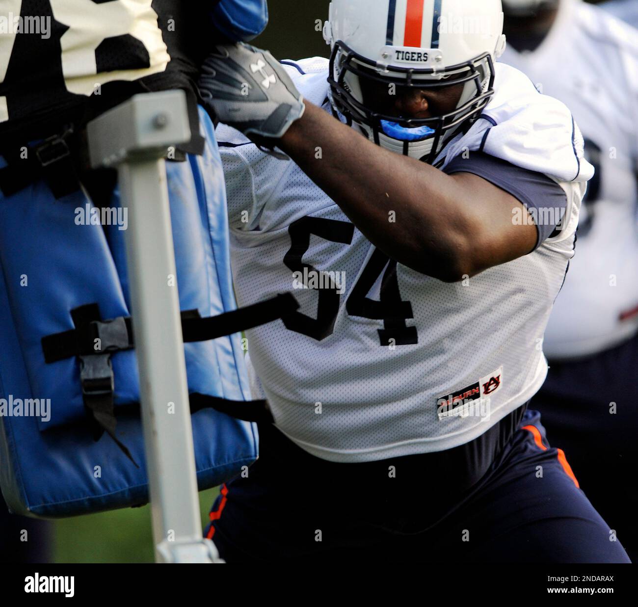 Auburn defensive lineman LaDarius Owens hits a sled during NCAA college ...