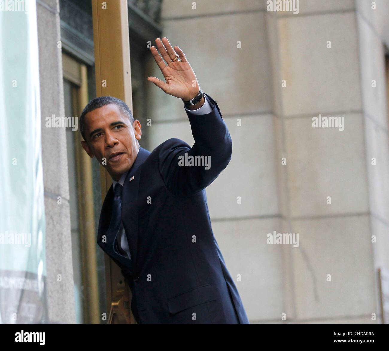 President Barack Obama steps outside the Chicago Cultural Center to ...