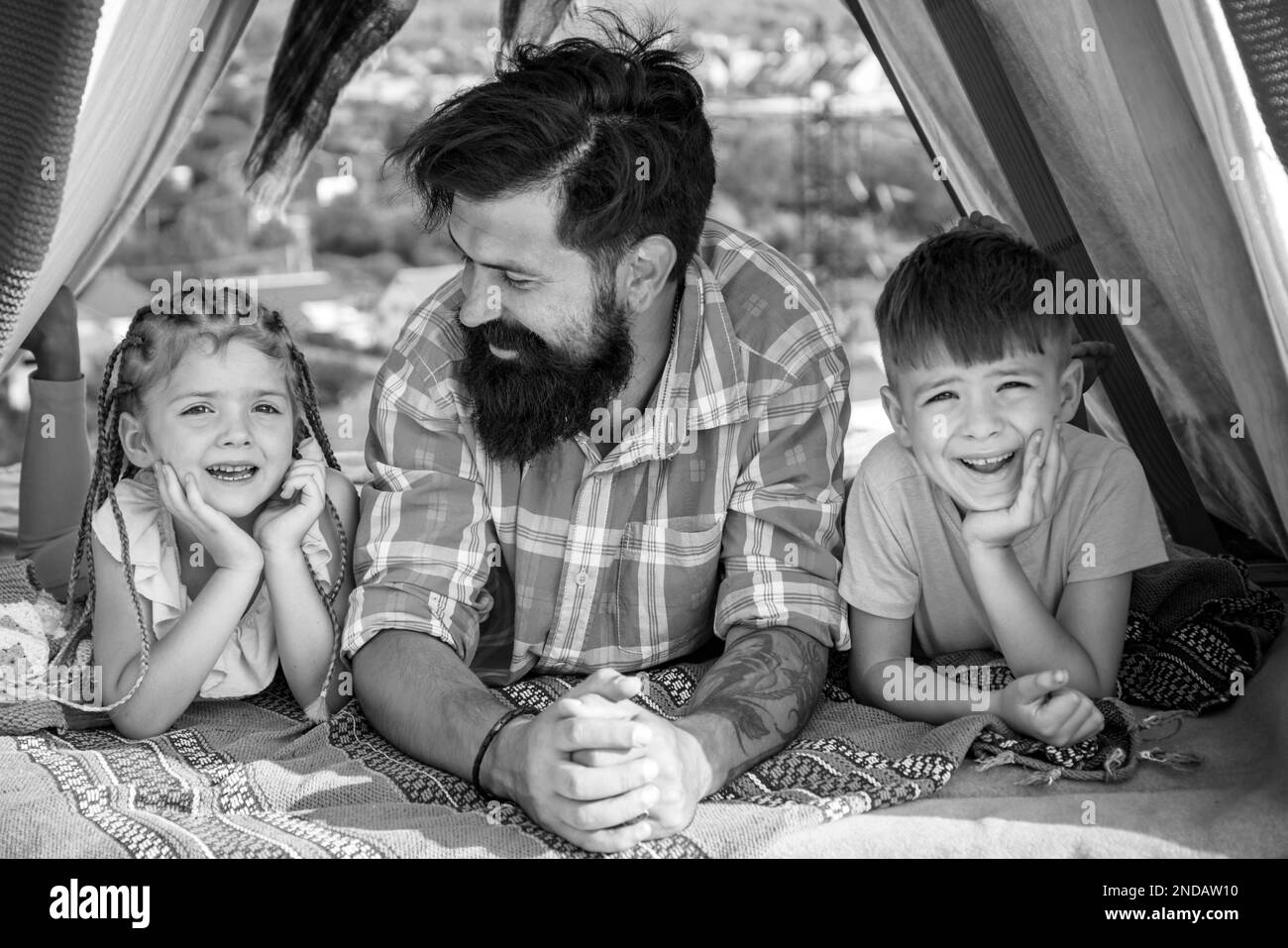 Father have fun with his cute daughter and son. Happy family enjoy ...