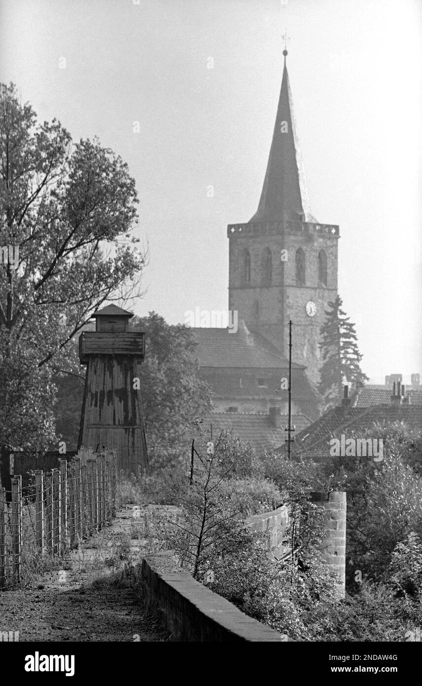 Two quite different types of towers. The church tower of the village of ...