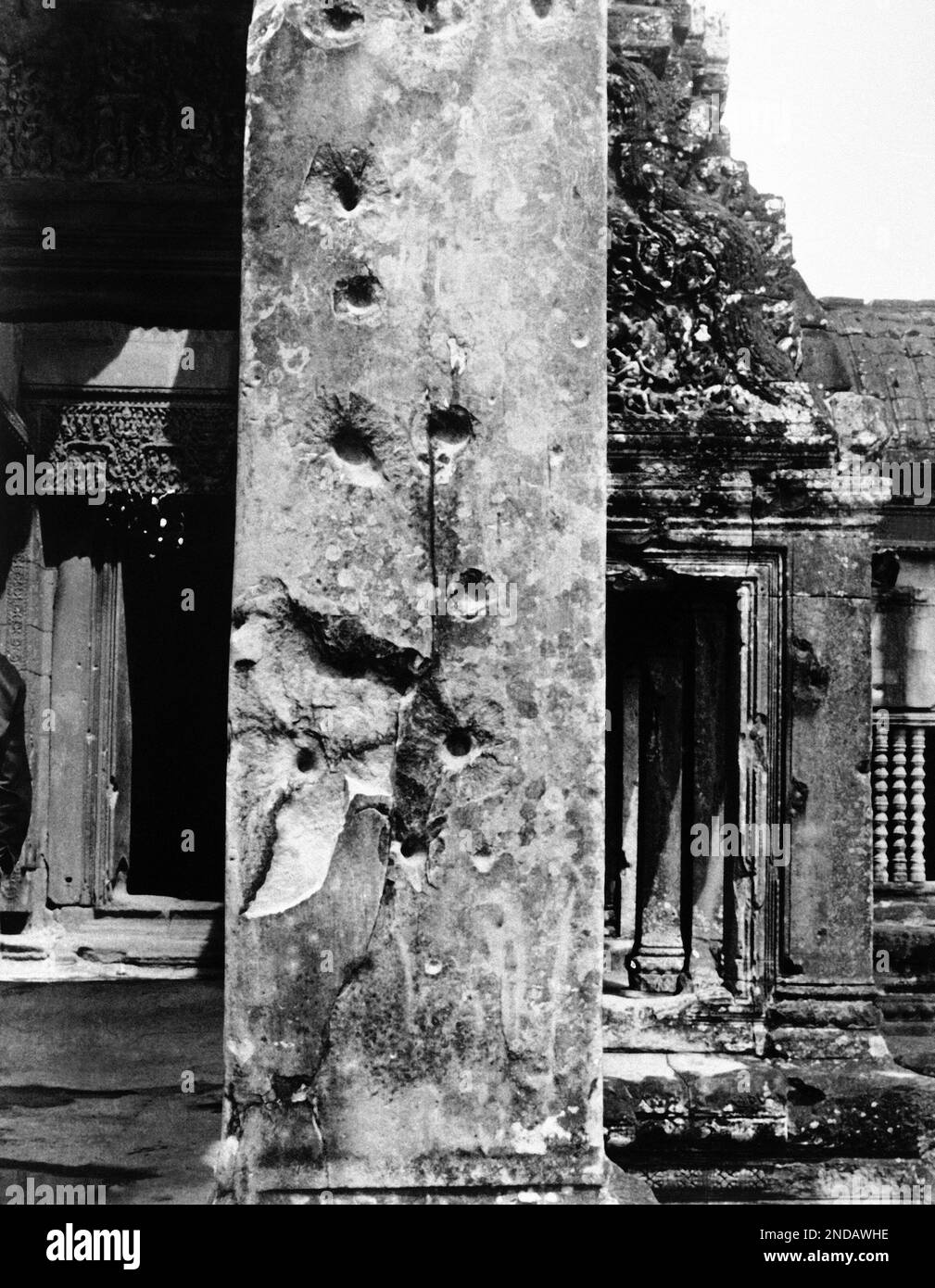 Several bullet marks are seen on a pillar of the main gate of Angkor ...