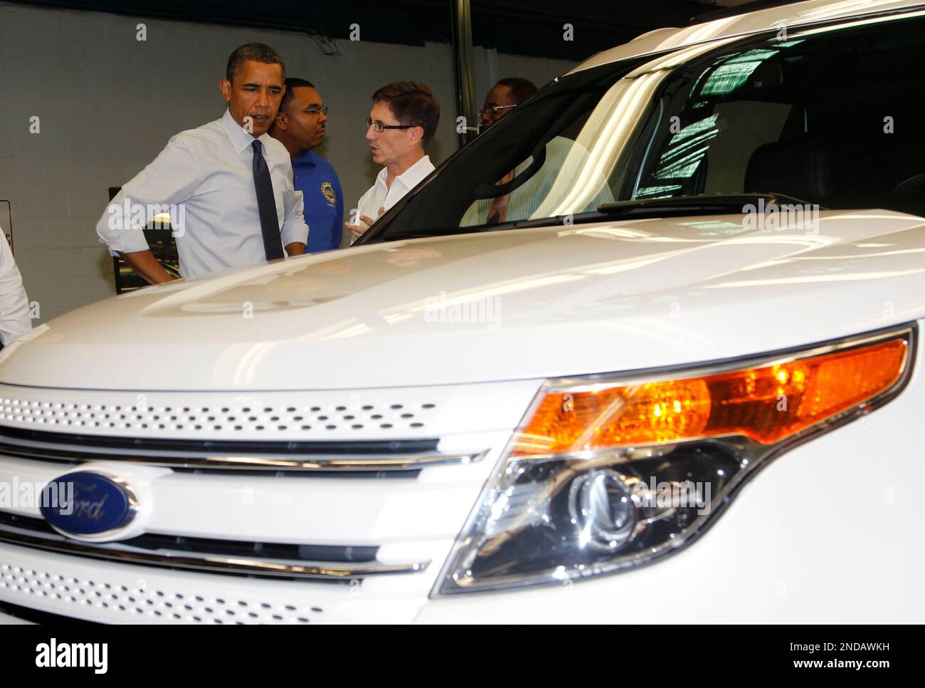 President Barack Obama looks over the 2011 Ford Explorer SUV with Ford ...