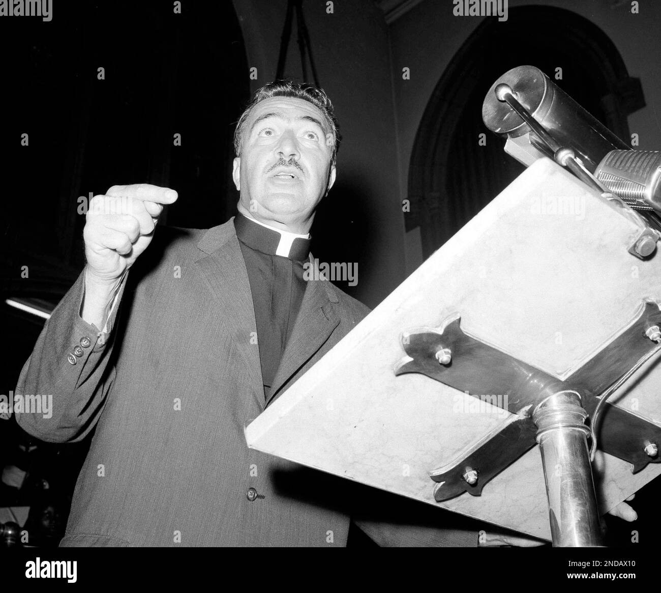 Rep. Adam Clayton Powell, Jr. (D-NY), officiates at morning service at ...