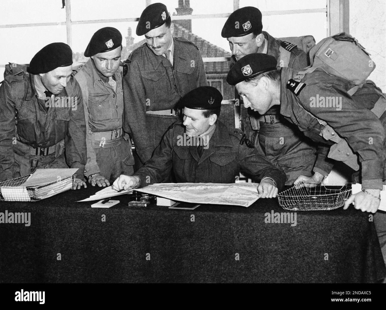 French and British Commando officers examine German strong points on a ...