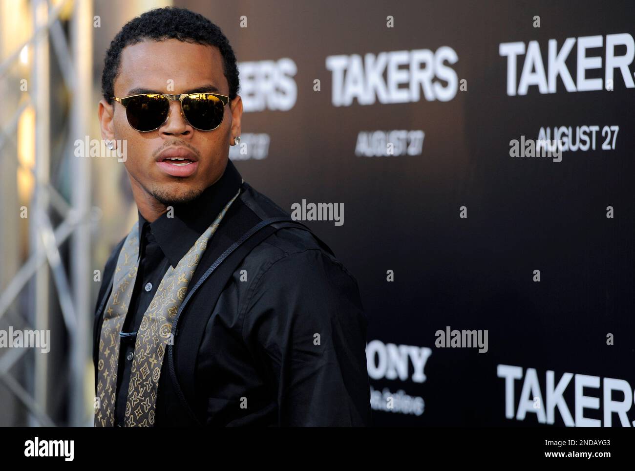 Chris Brown, a cast member in "Takers," poses at the premiere of the ...