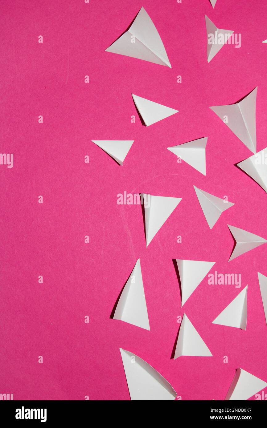 A Pink and White Geometric Folded Paper Triangle Shapes for Background ...
