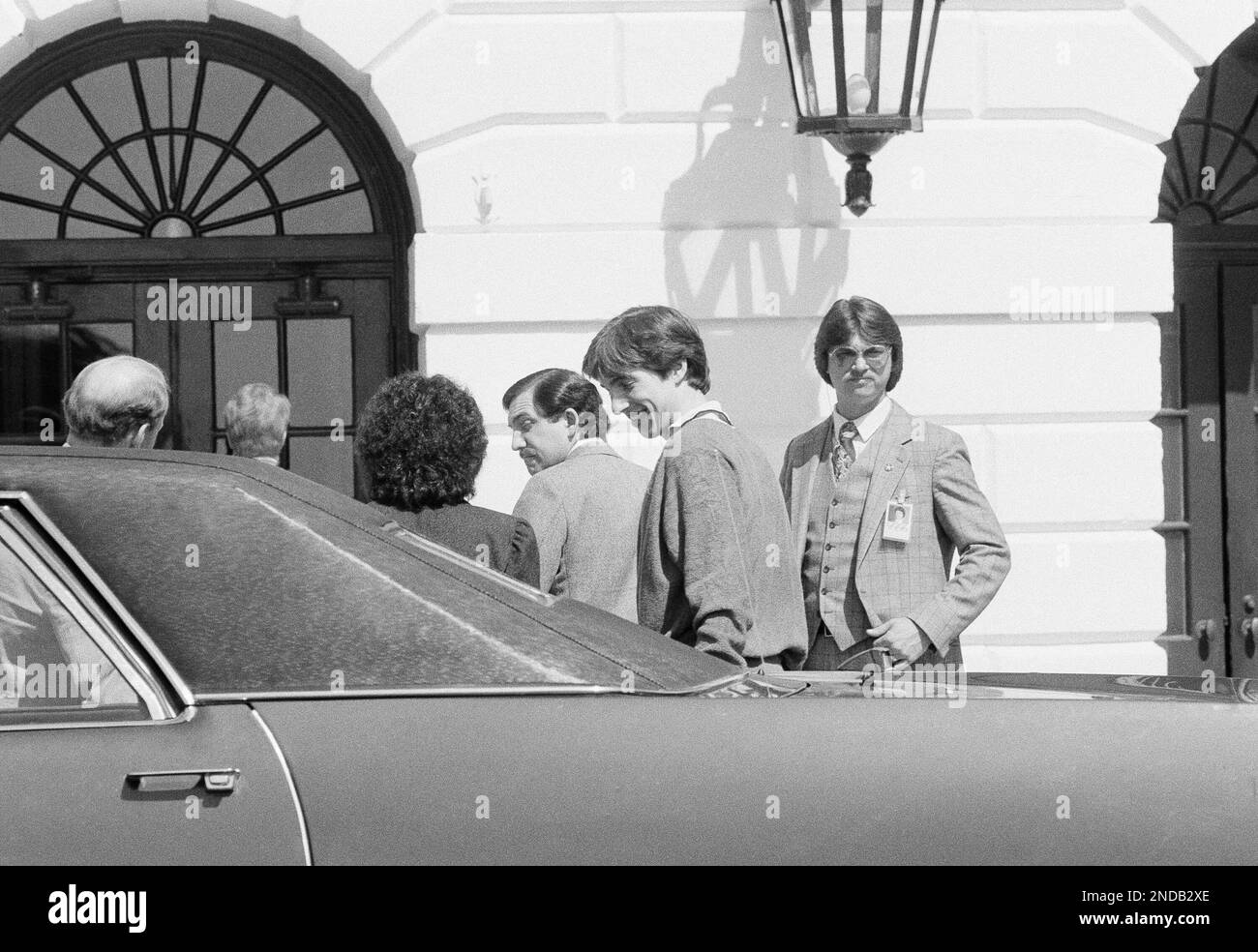Ronald Reagan Jr., and his wife Doria, back to camera, arrive at the ...