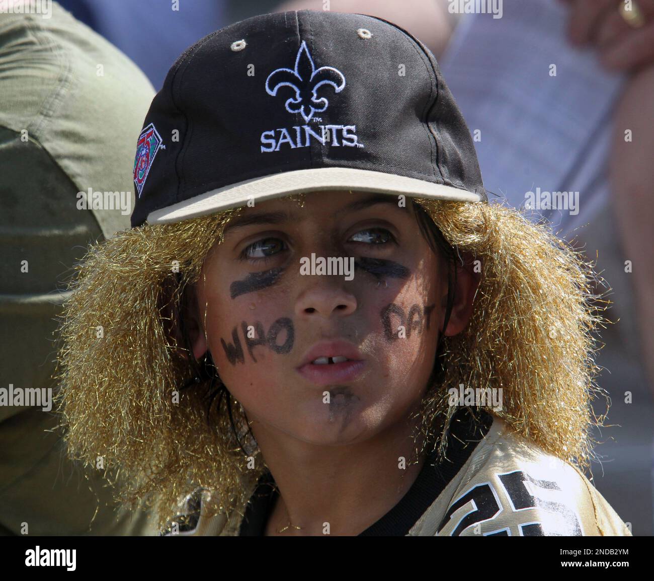 A young New Orleans Saints fan watches the afternoon practice session ...