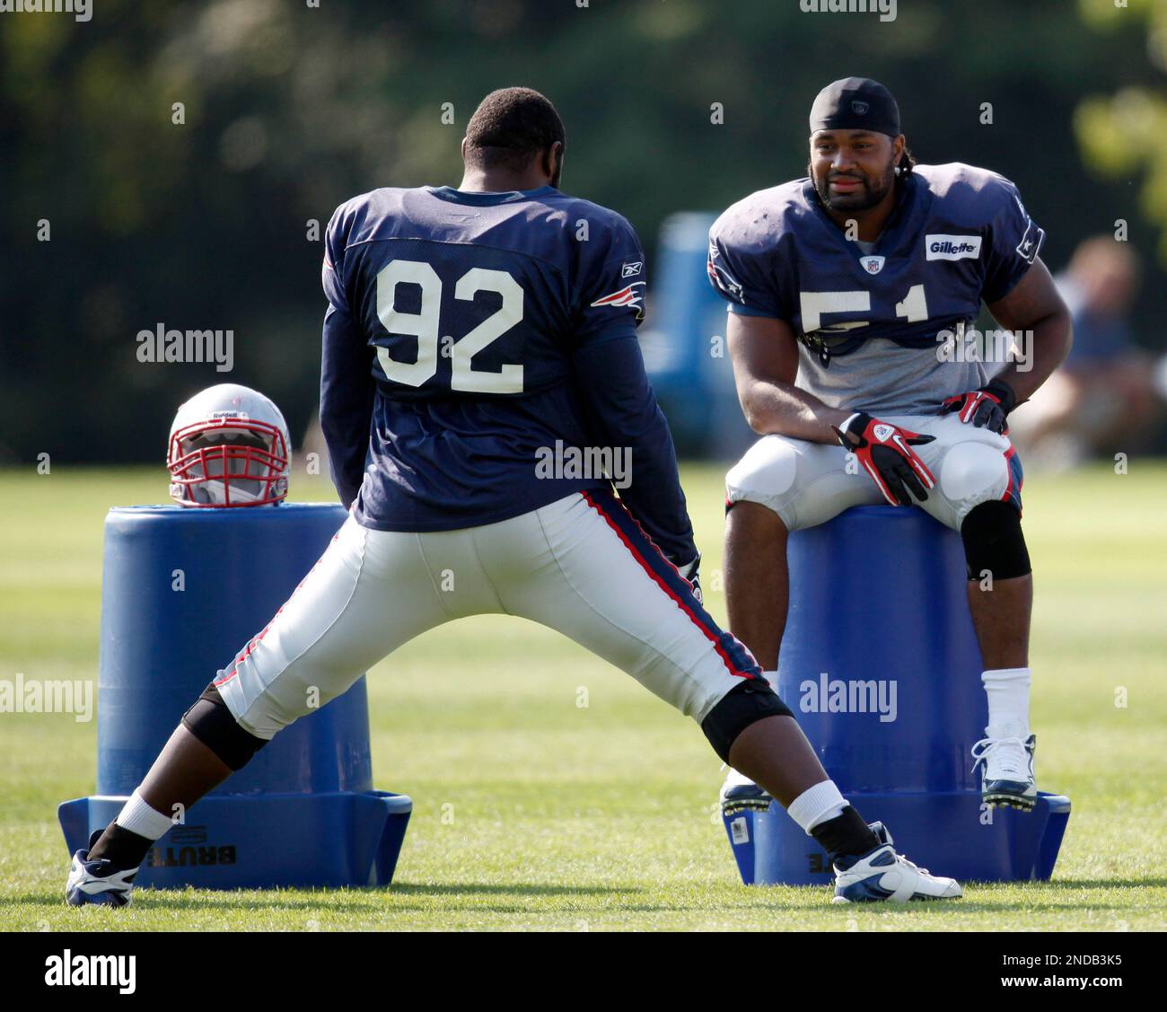 New England Patriots' Jerod Mayo, right, talks with Damione Lewis ...
