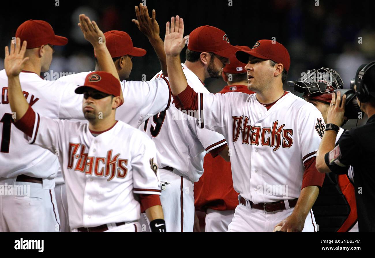 Arizona Diamondbacks' Joe Saunders, right, and Augie Ojeda celebrate a ...