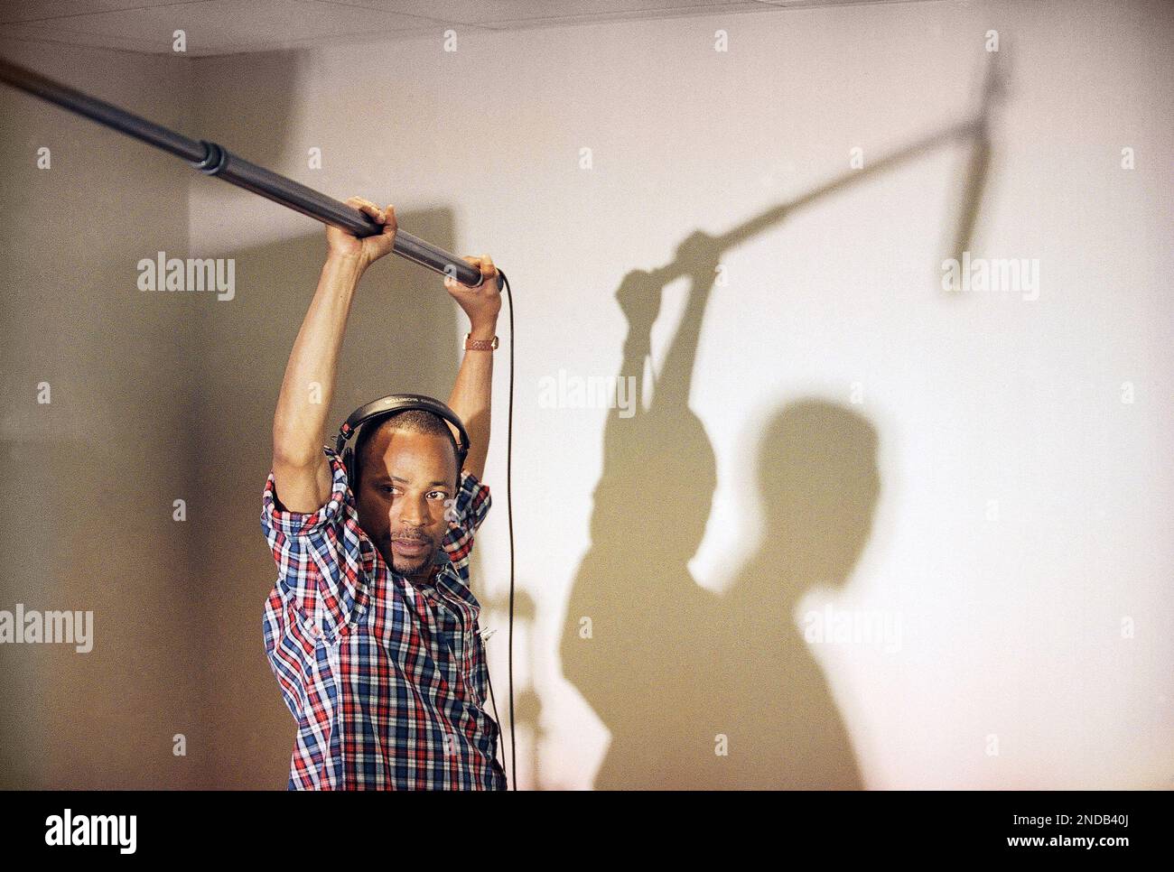 Boom operator Reggie Dunn records lead actor Khalil Kain, seen in ...