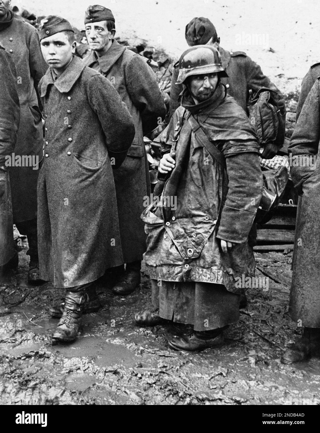 Wearing a ground sheet to protect his over-sized great coat from the ...