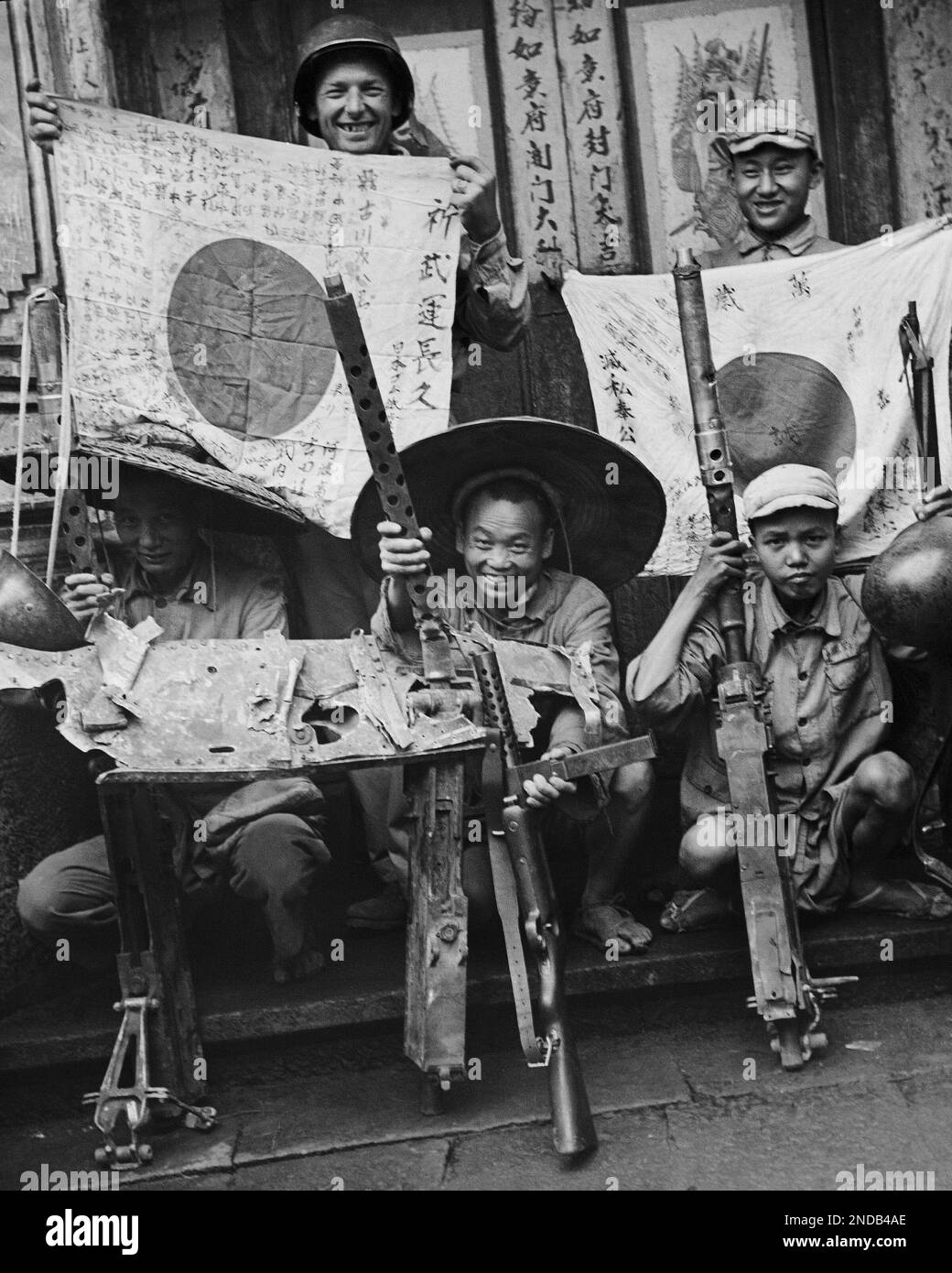 Happy Allied soldiers display booty takeen from the Japanese in the ...