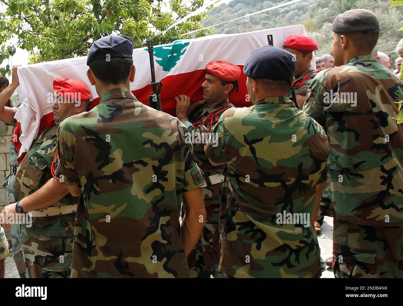 Lebanese soldiers from the military police unit, carry the coffin of ...