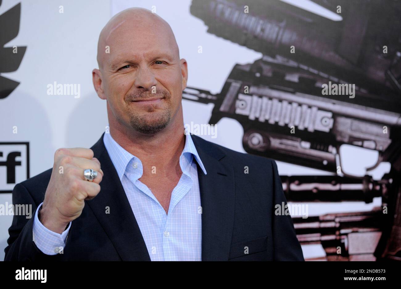 Steve Austin, a cast member in "The Expendables," poses at the premiere ...