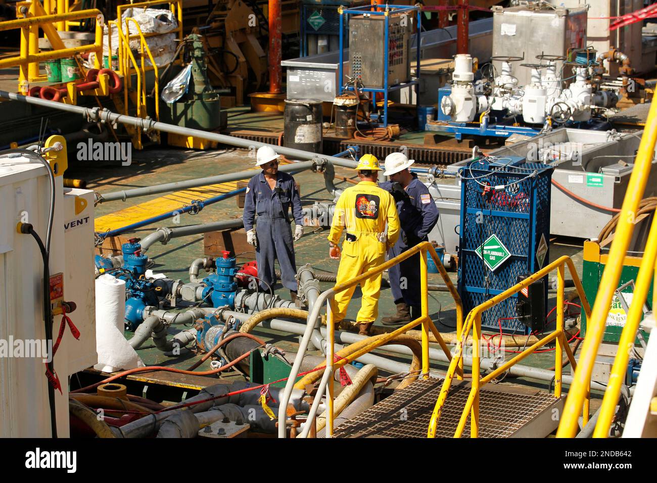 Workers on the Helix Q4000, which is performing the static kill ...