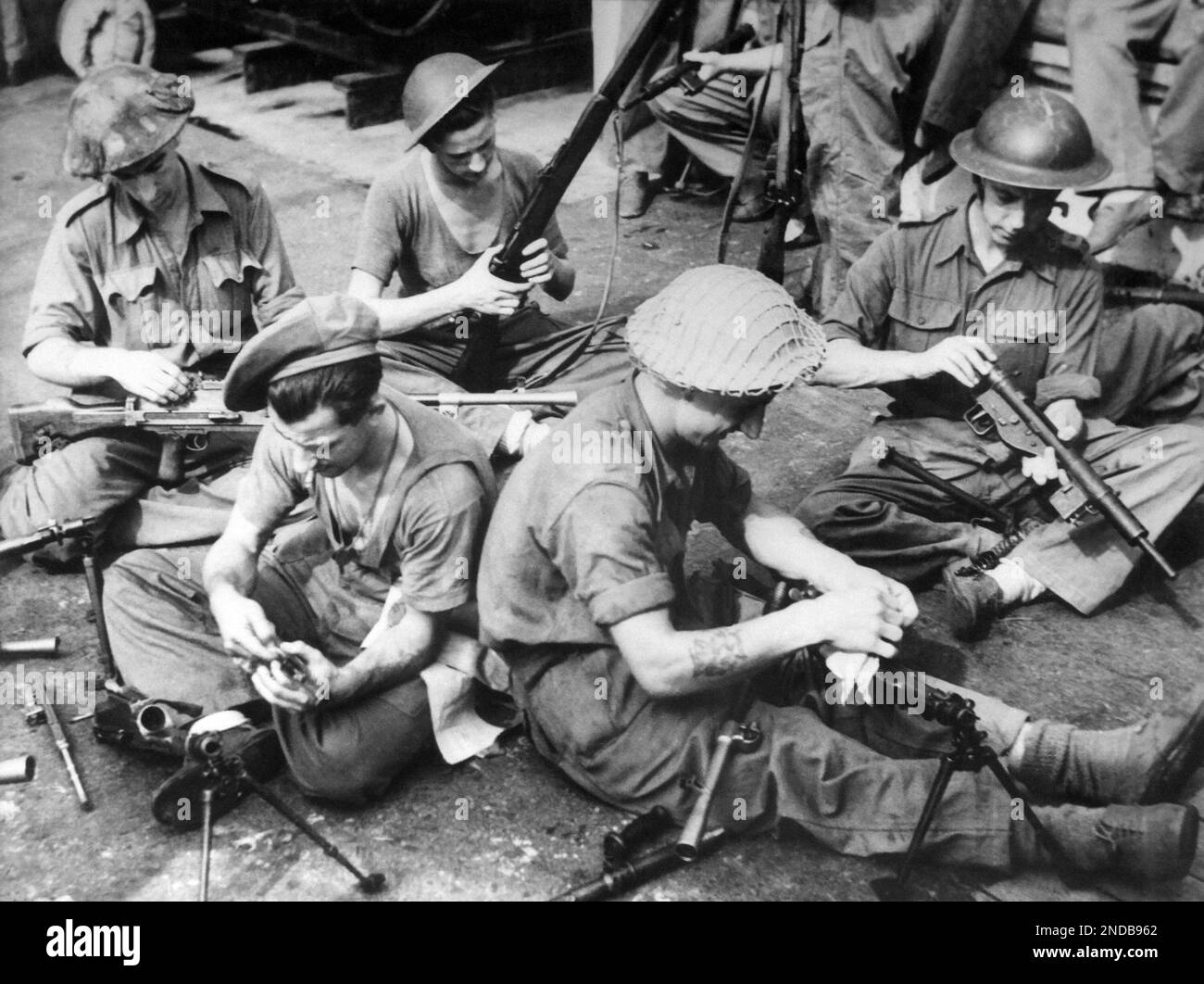 Troops of a Royal Artillery Field Regiment on board the sloop which ...