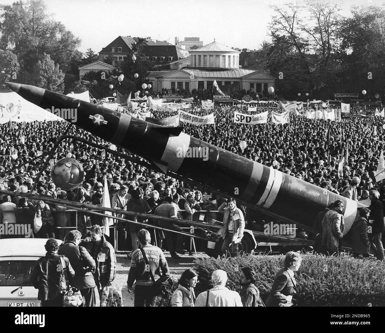 A life-size mockup of a Pershing II missile dwarfs the demonstrators of ...