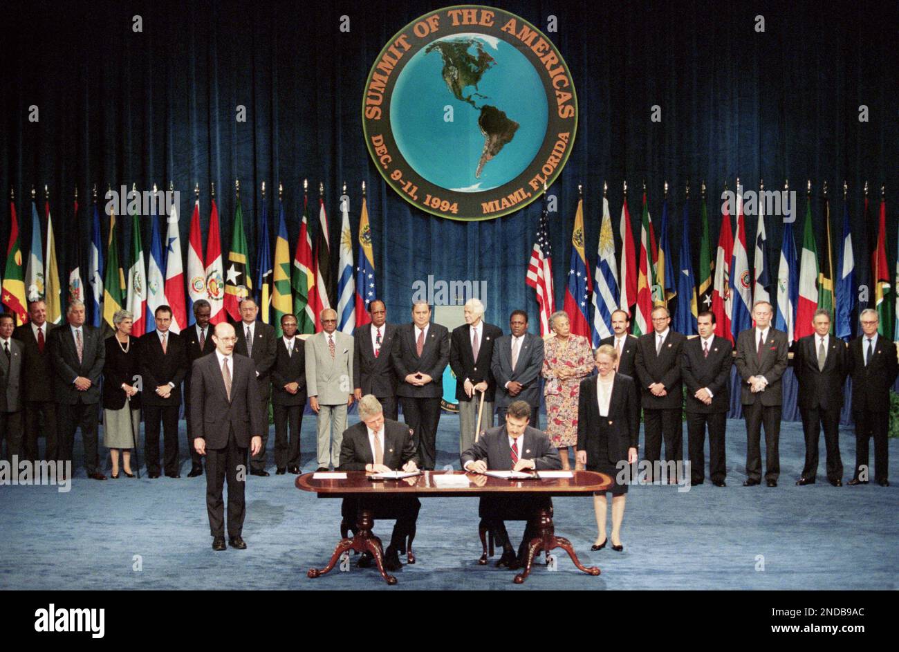 As other leaders attending the Summit of the Americas looks on ...