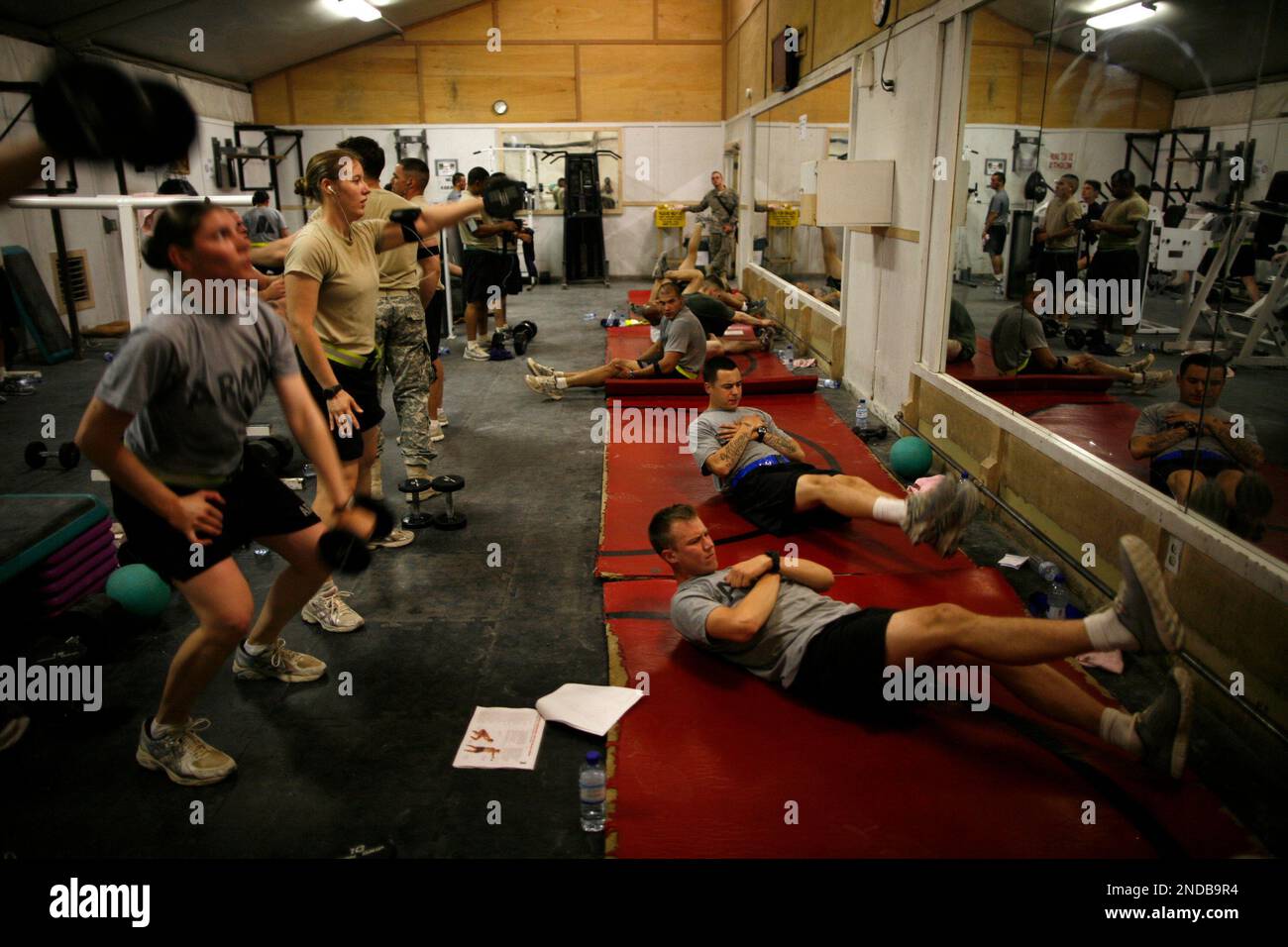 A U.S soldiers lifts weights in a gym on Kandahar Airfield, Afghanistan ...