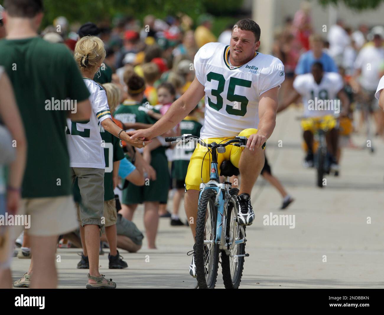 Green Bay Packers' Korey Hall rides a bike to NFL football training ...