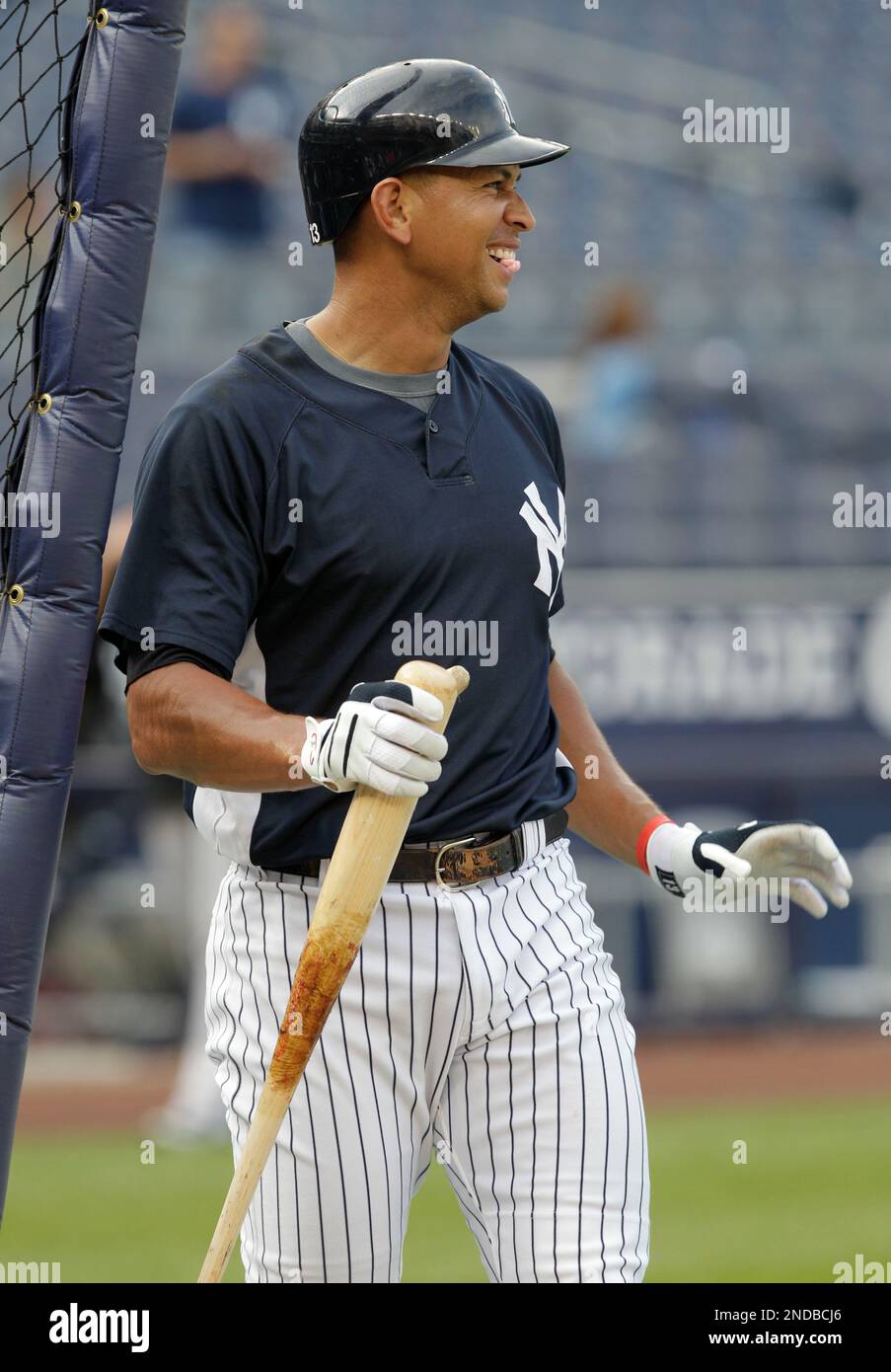 New York Yankees' Alex Rodriguez smiles as he emerges from the batting ...