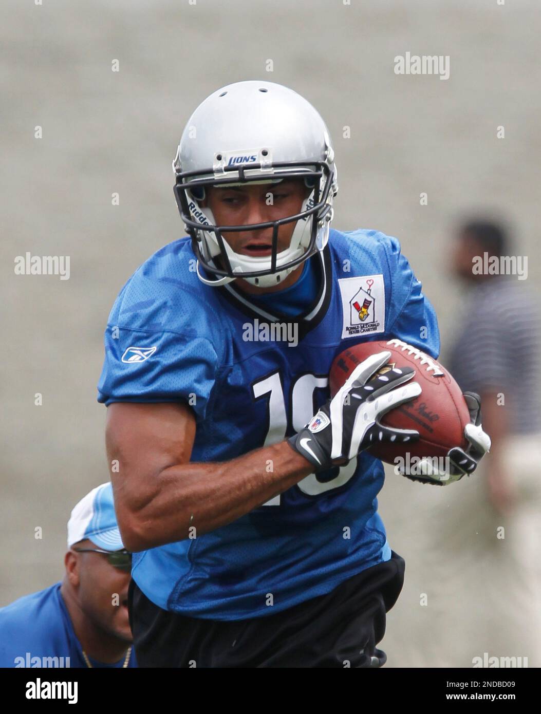 Detroit Lions receiver Eric Fowler runs drills during football camp at ...