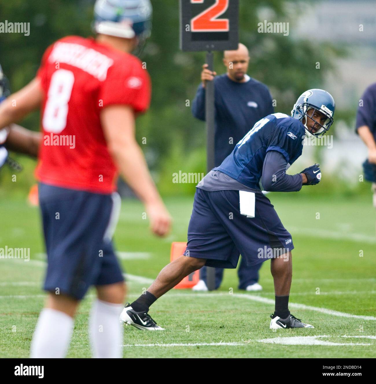 Seattle Seahawks wide receiver Ben Obomanu looks back to quarterback ...