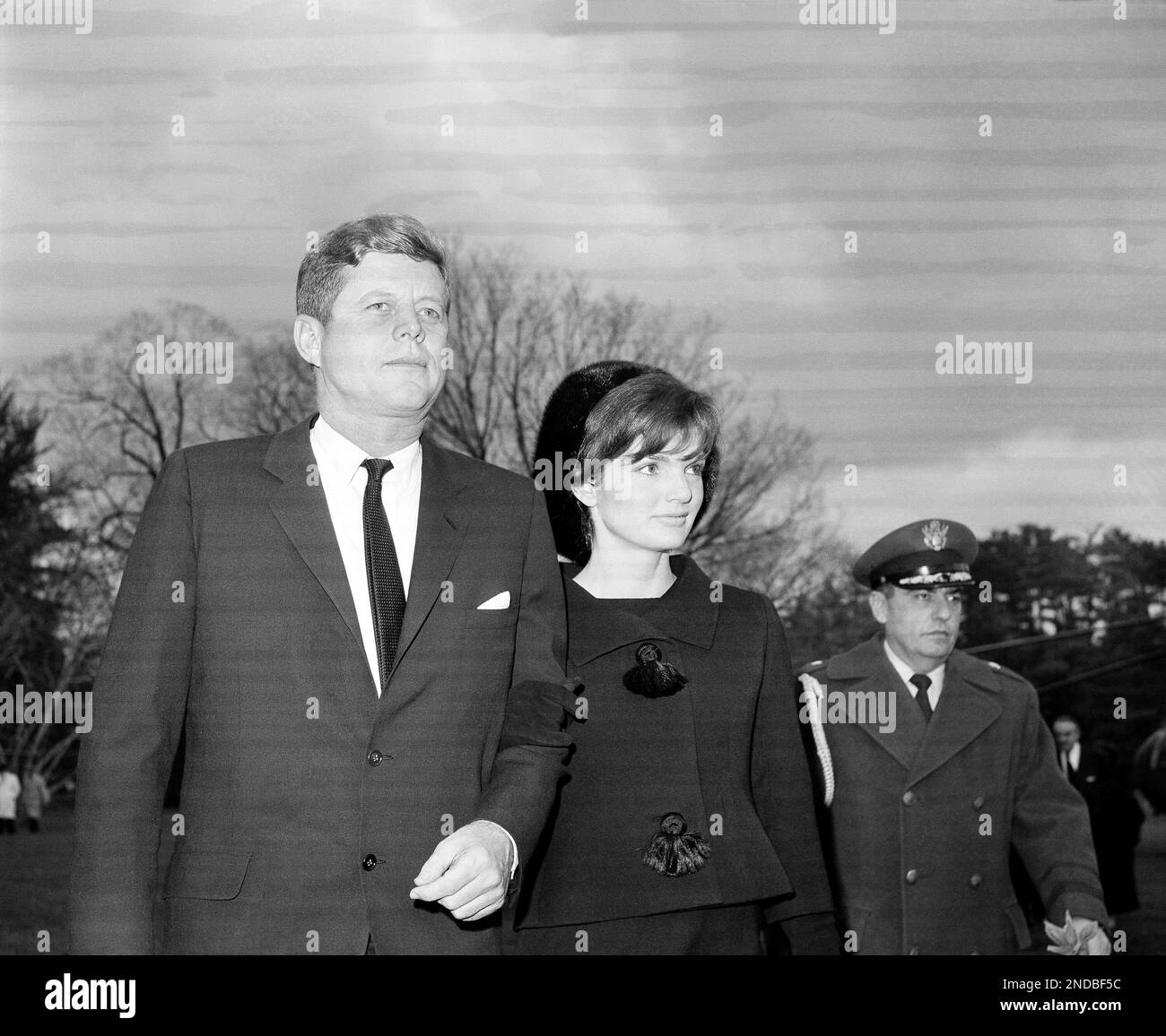 President John F. Kennedy walks with his wife Jacqueline after arrival ...