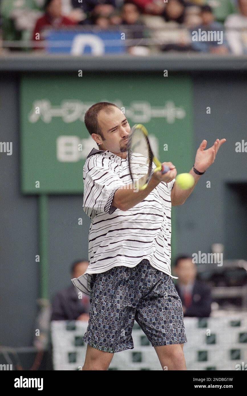 Andre Agassi returns a shot to Jim Courier in the men’s singles finals ...