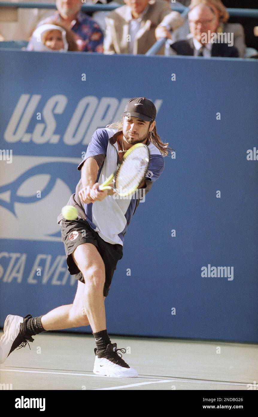 Andre Agassi of Las Vegas returns a shot against fourth seed Michael ...