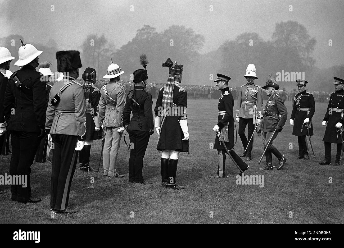 Britain's King George VI, fifth from right, followed by General Chavell ...