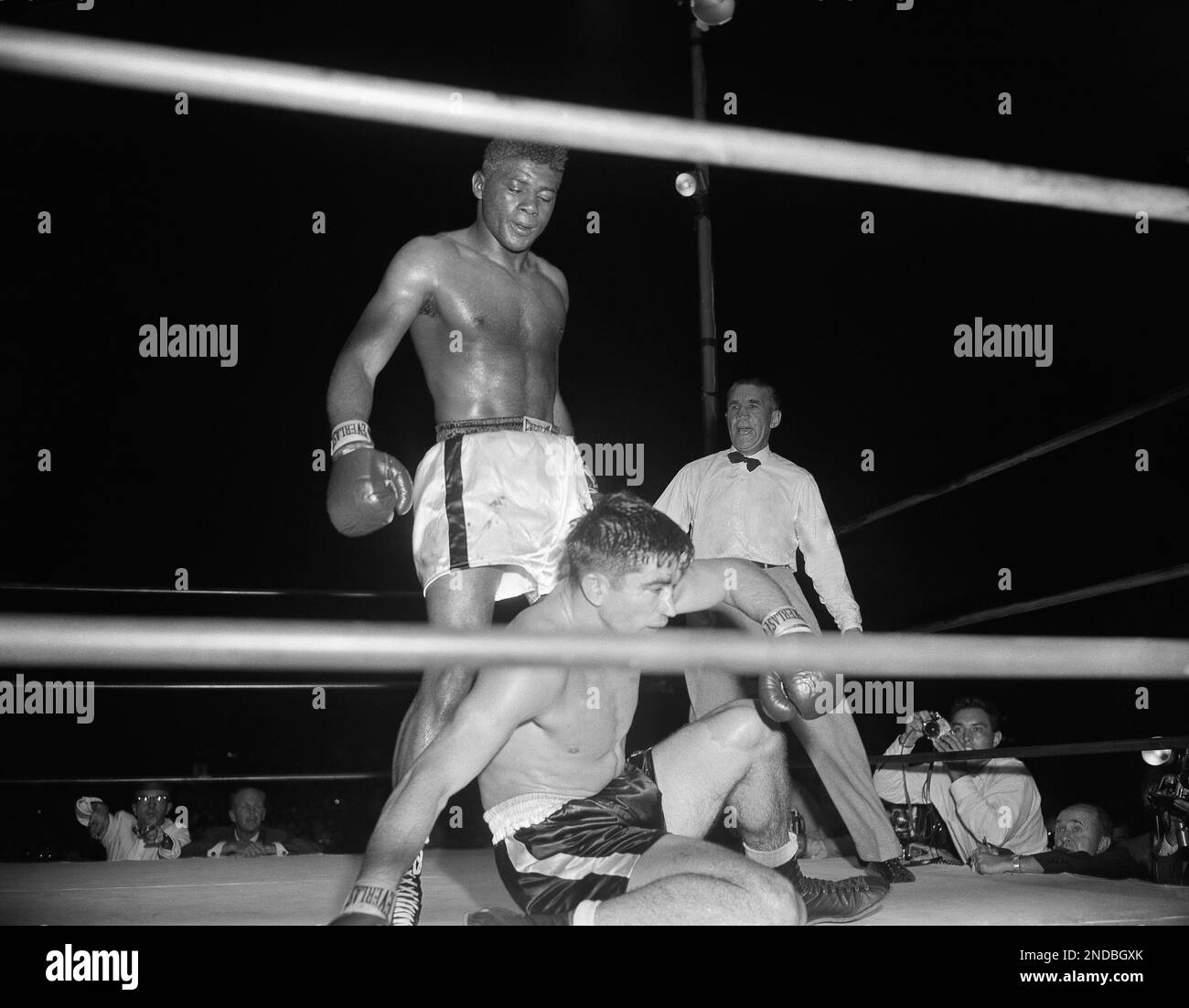 Challenger Roy Harris is on the canvas in the seventh round as champion ...