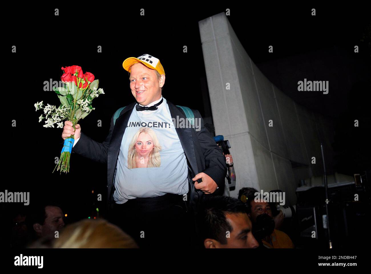 Lindsay Lohan fan, Jake Byrd of Chino, Calif., stands on a ladder among ...